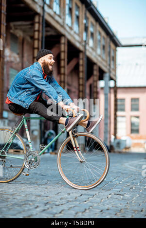 Crazy man riding bicycle on winter snowy landscape. Christmas and new year with fun Stock Photo ...