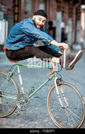 Crazy man riding bicycle on winter snowy landscape. Christmas and new year with fun Stock Photo ...
