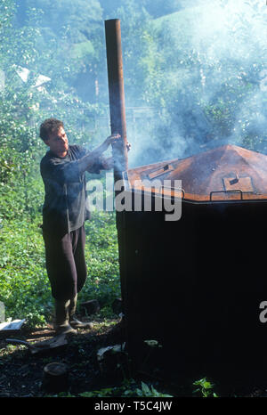 Traditional charcoal making kiln burning wood for charcoal in Kenya ...