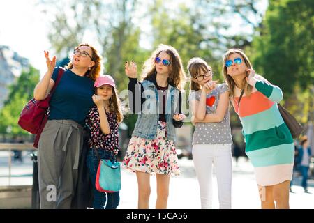 Group of girls pointing to interesting places, mothers and daughters ...