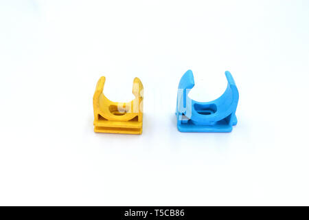Blue, Yellow PVC pipe connections and Pipe clip isolated on white ...