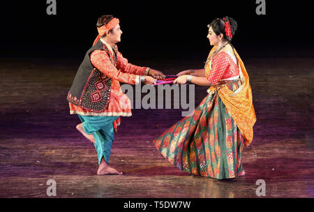 Couple perform traditional Indian folk dance of Goa on stage wearing ...