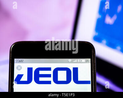 In this photo illustration a JEOL Ltd. logo seen displayed on a smart ...