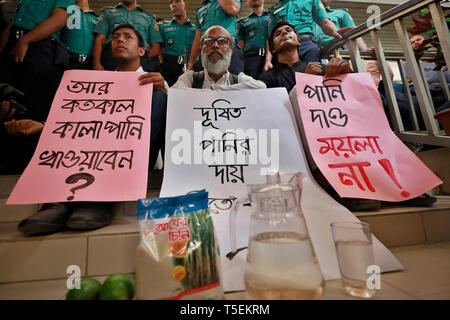 Dhaka, Bangladesh - April 23, 2019: A family sits on the stairs of the ...