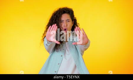 Woman with face disgusted raising hand isolated. Girl with disgust face ...