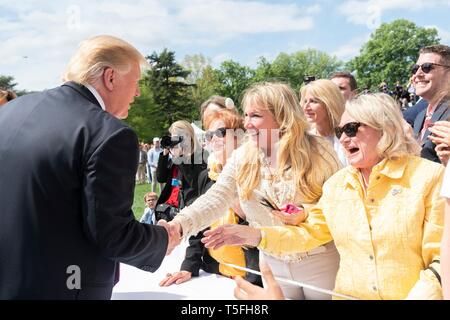 President Donald Trump greets guests on the South Lawn of the White ...