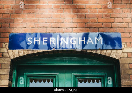 Station name sign on the wall of Victoria station on the London ...