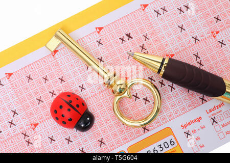 Lottery - A filled lottery ticket with pen and luck symbols Stock Photo ...