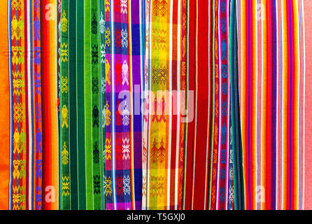 A stack of Andes Textiles on a local handicraft market, Cusco, Peru ...