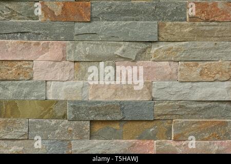 Stacked stone wall, natural stone cladding. Stone wall for background ...
