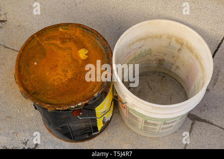Old, black metal bucket, dented and rusty, close-up Stock Photo - Alamy