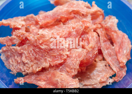 Dried meat 100 grams lies on plastic scales Stock Photo - Alamy