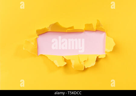 Yellow torned paper over pink background with pencil Stock Photo - Alamy