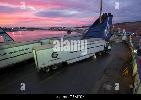 Driving trucks onto a Baja ferry in Pichilingue, Baja California Sur ...