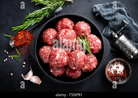 Fresh raw beef meatballs with spices Stock Photo - Alamy