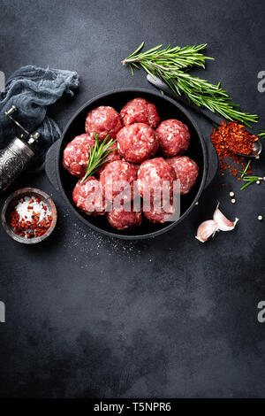 Fresh raw beef meatballs with spices Stock Photo - Alamy