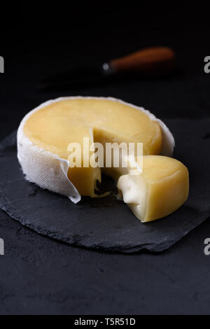 Butter soft creamy sheep cheese from Seia region Portugal on black ...