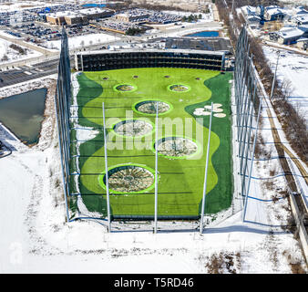 A drone / aerial view of TopGolf. Topgolf features three floors of ...