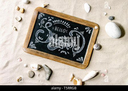 Summer theme on sand Stock Photo - Alamy