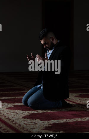Attractive Man Making Traditional Prayer to God Allah in the Mosque ...