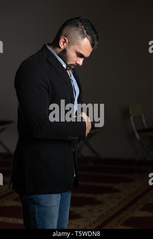 Attractive Man Making Traditional Prayer to God Allah in the Mosque ...
