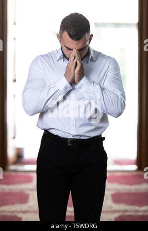 Attractive Man Making Traditional Prayer to God Allah in the Mosque ...