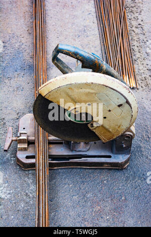 Construction worker cutting steel rods Stock Photo - Alamy