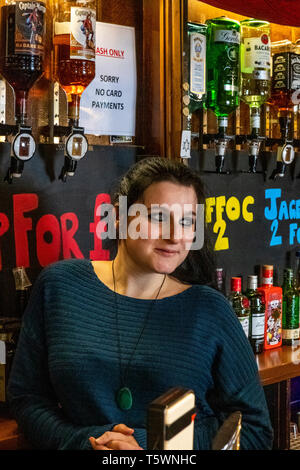 A barmaid at The Five Alls pub poses for photographers. Chepstow street ...
