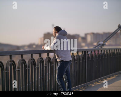 Man on Bridge Stock Photo - Alamy