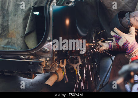 Automotive production line. Welding car body. Modern car Assembly plant ...