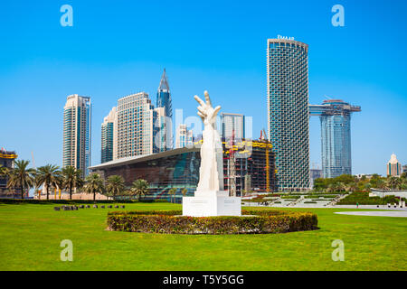 Three finger statue in Burj Khalifa Park in Dubai Stock Photo - Alamy