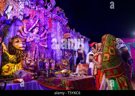Devotees seen praying during the ritual. Jagran is a Hindu ritual ...