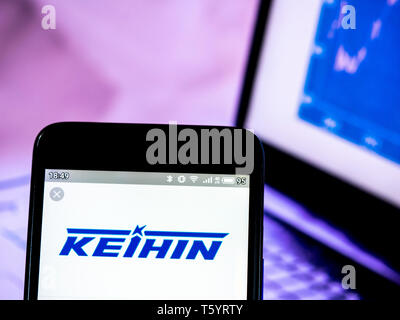 In this photo illustration a Keihin Corporation logo seen displayed on ...