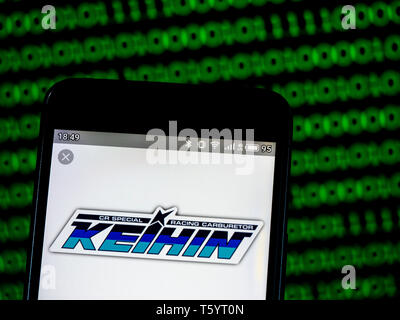 In this photo illustration a Keihin Corporation logo seen displayed on ...