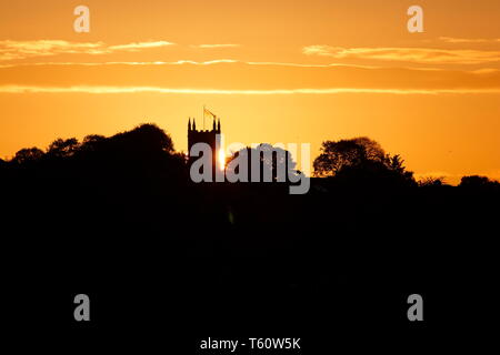 The sun rising behind St Mary's Church in Swillington,West Yorkshire,UK ...