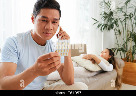 a calling wife and her husband Stock Photo - Alamy