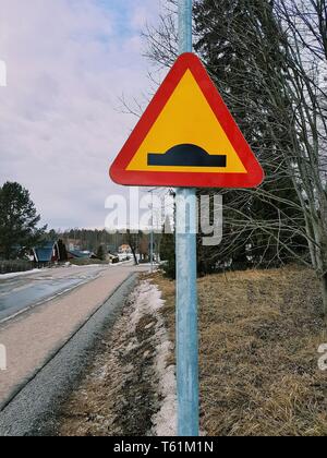 attention street bumps ahead road sign, red triangle, industrial site ...