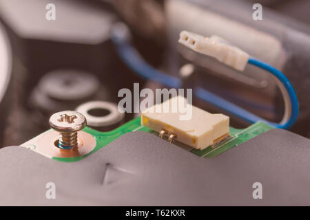 Metal bolt fastening. Computer connector and cable on the processor ...