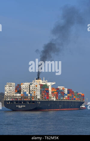 Navios Unison grinds out black smoke Stock Photo - Alamy