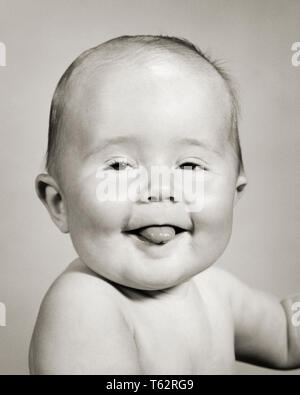 stylish child girl looking funny on blue background, human emotions ...