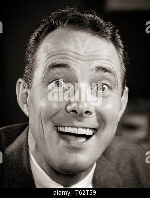 shocked and surprised man smiles into the camera. emotional guy ...