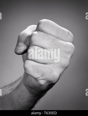 Emotional man gestures with his hands displeasure white t-shirt light ...