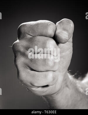 Emotional man gestures with his hands displeasure white t-shirt light ...