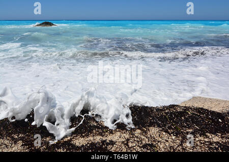 waves splash on frozen stone Stock Photo - Alamy