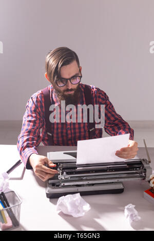 Writer's day and technology concept - Handsome writer surrounded by ...