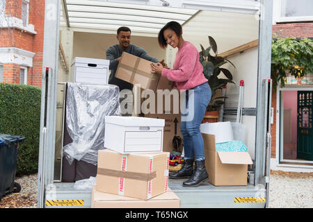 Moving van outside house Stock Photo - Alamy