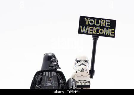 lego storm trooper holding you are welcome sign. Lego minifigures are ...