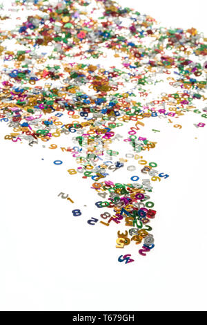 small color numbers confetti isolated on white background with empty ...