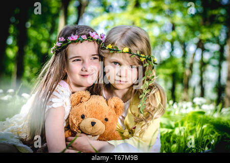 Two beautiful girls friends in autumn park Stock Photo - Alamy