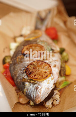 fish with vegetables in the parchment Stock Photo - Alamy